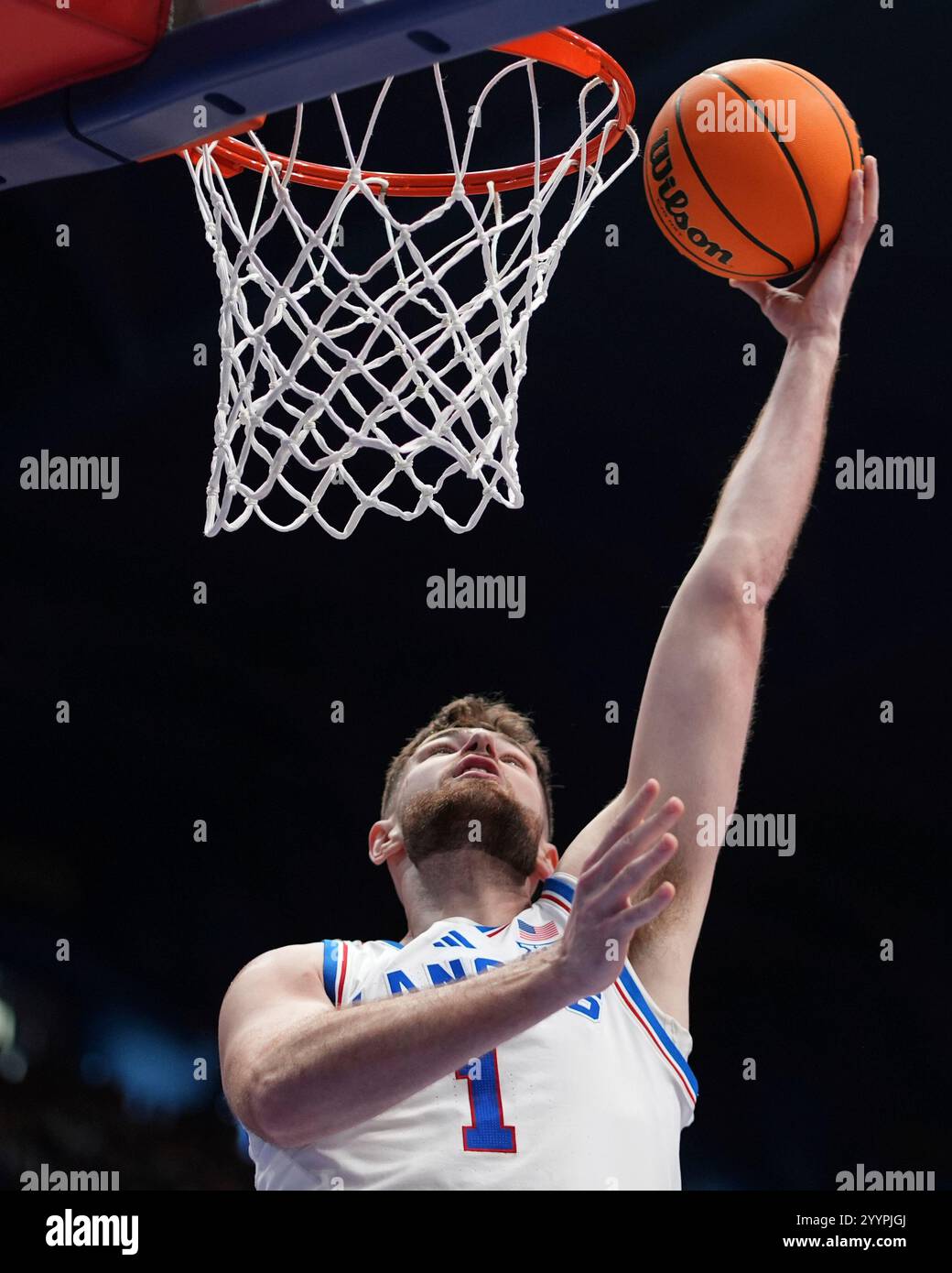 Kansas center Hunter Dickinson shoots during the first half of an NCAA ...