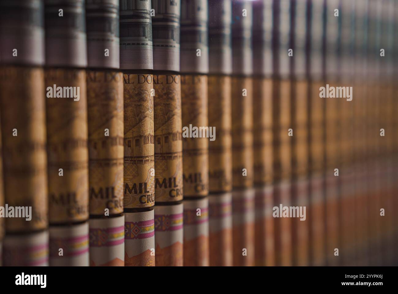A detailed close up of cigars showcasing rich brown and gold bands. The ...