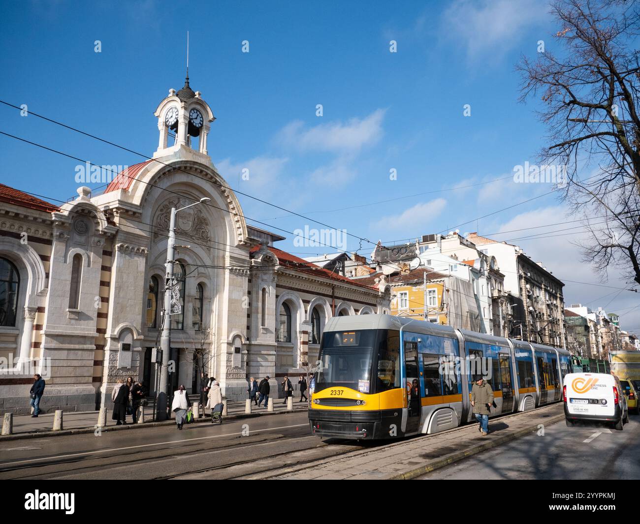 Sofia, Bulgaria; December 9th 2024: Modern tram passing by a historic ...
