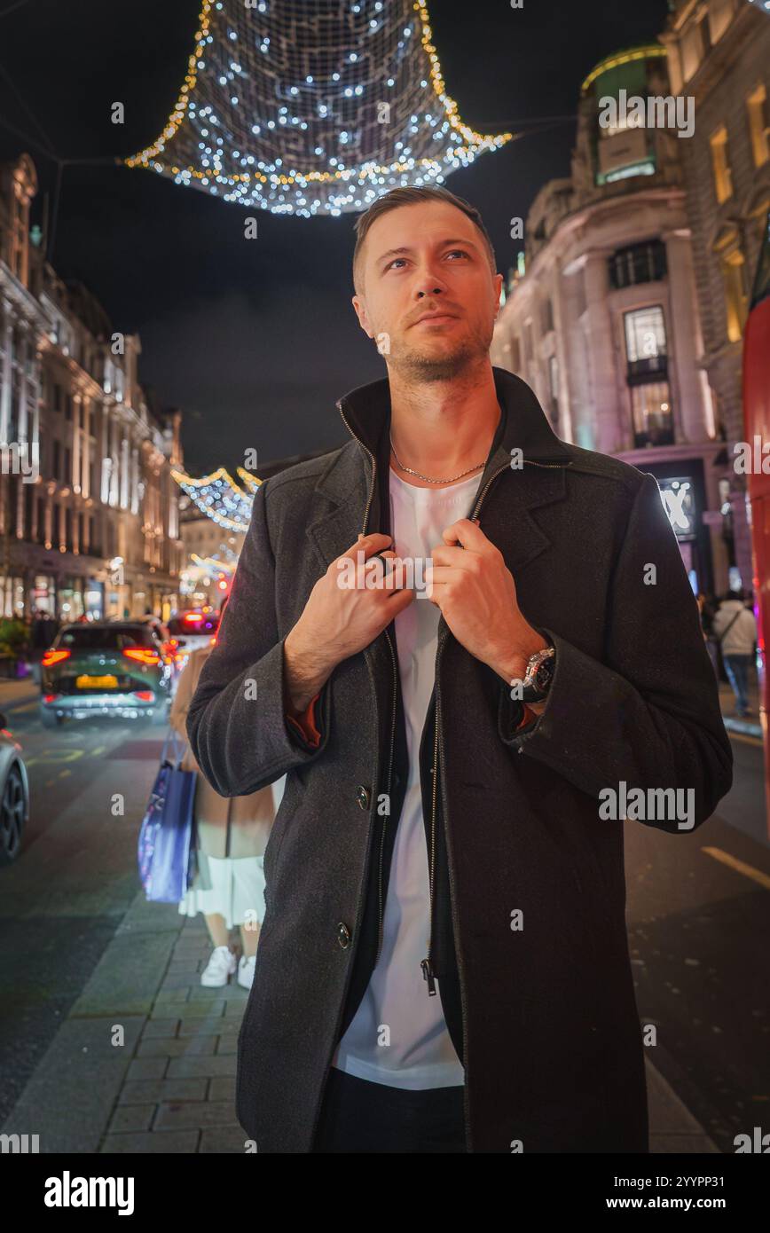 A bustling London street is adorned with elaborate Christmas lights ...