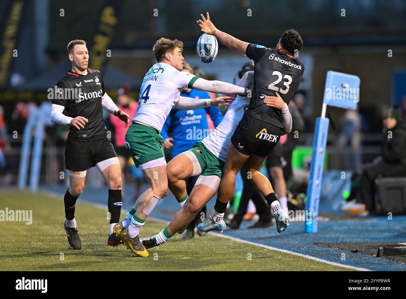 Brandon Jackson of Saracens releases the ball as he is challenged by ...