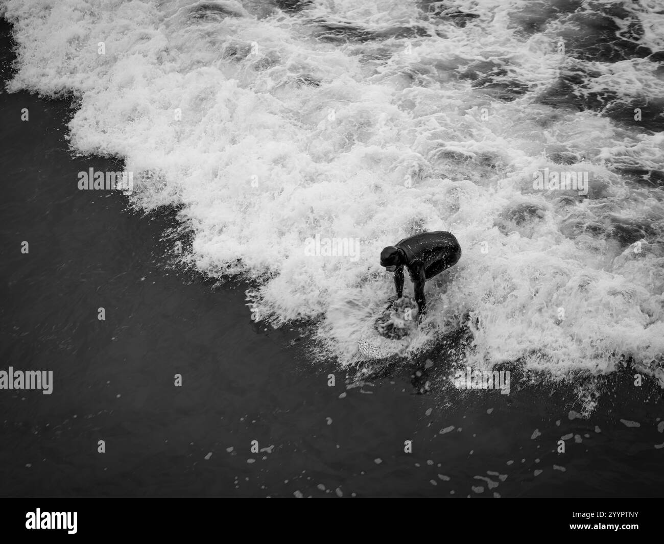 Riding the wave on a board Stock Photo - Alamy