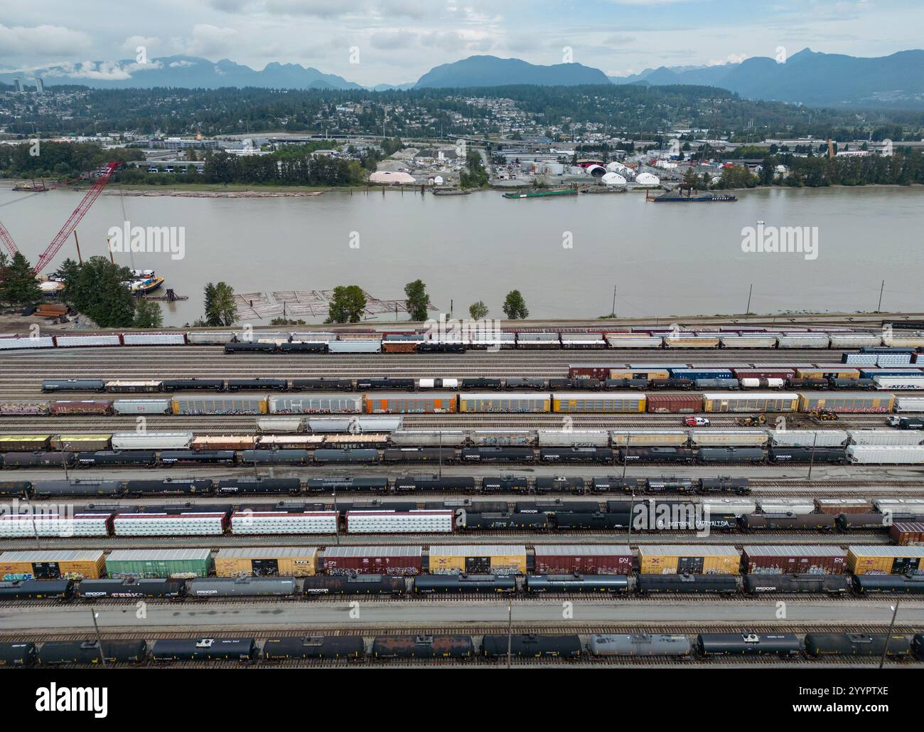 Surrey, Canada. 22nd Aug, 2024. Train cars are seen on the tracks in an ...