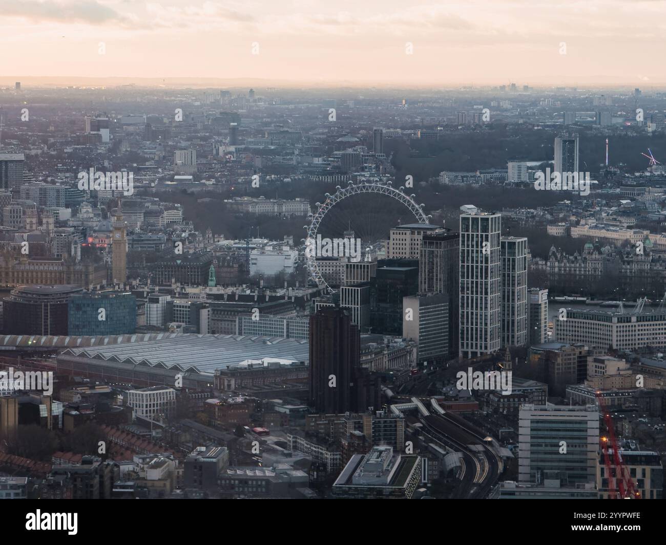 The image shows London's skyline with the London Eye at the center ...