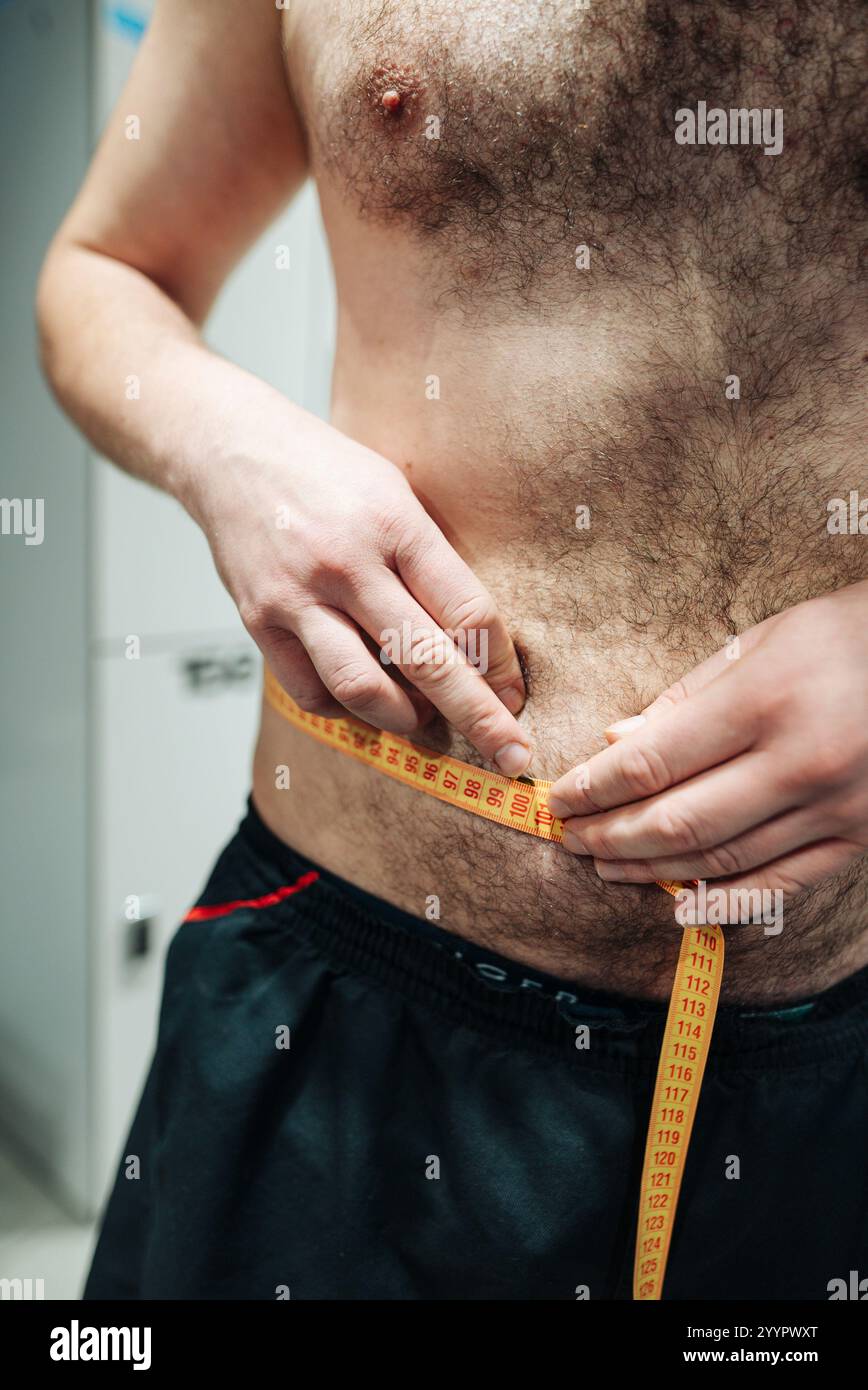 Fitness trainer measuring waist hi-res stock photography and images - Alamy