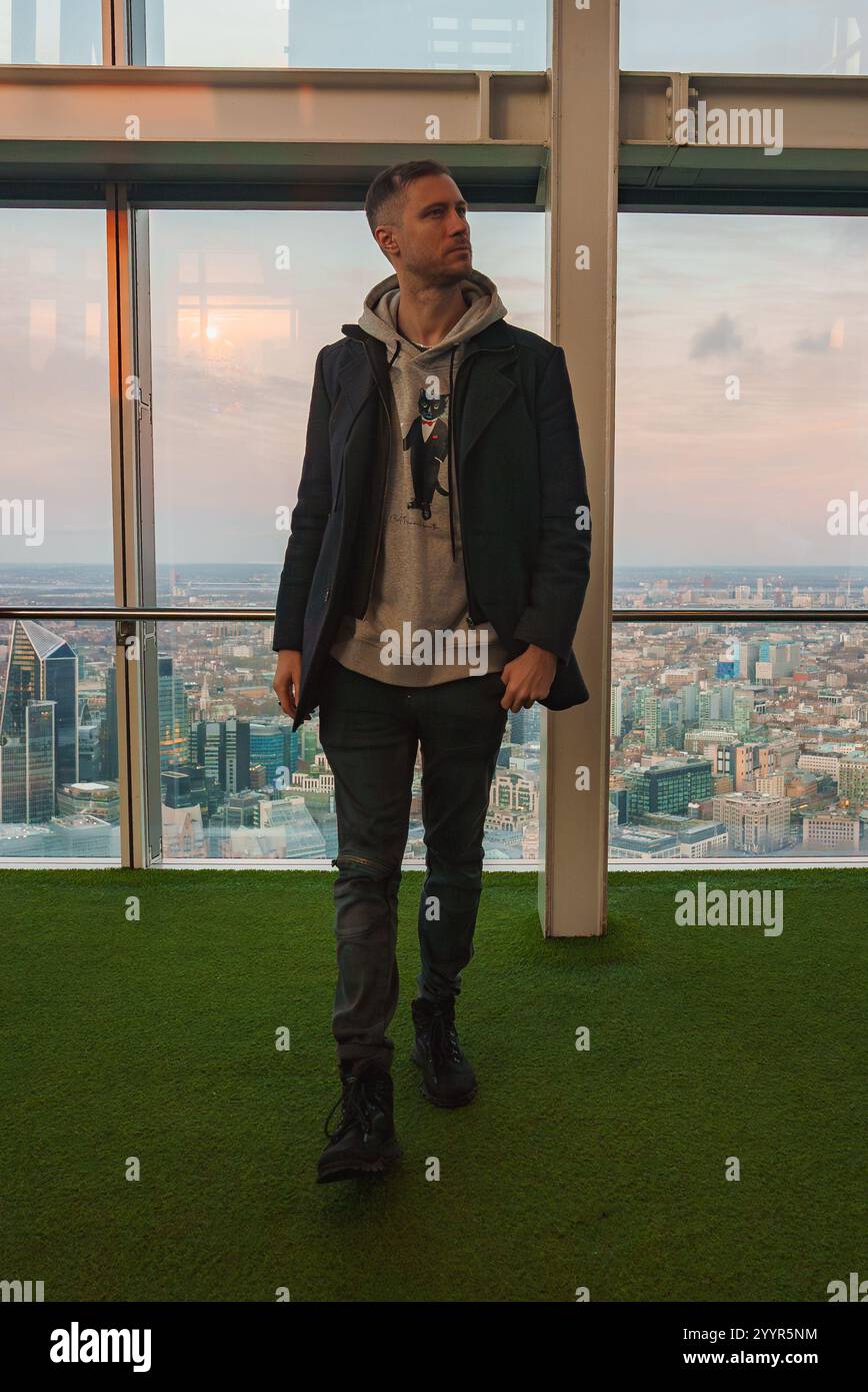 Person in High Rise with Panoramic View of London Cityscape Stock Photo ...