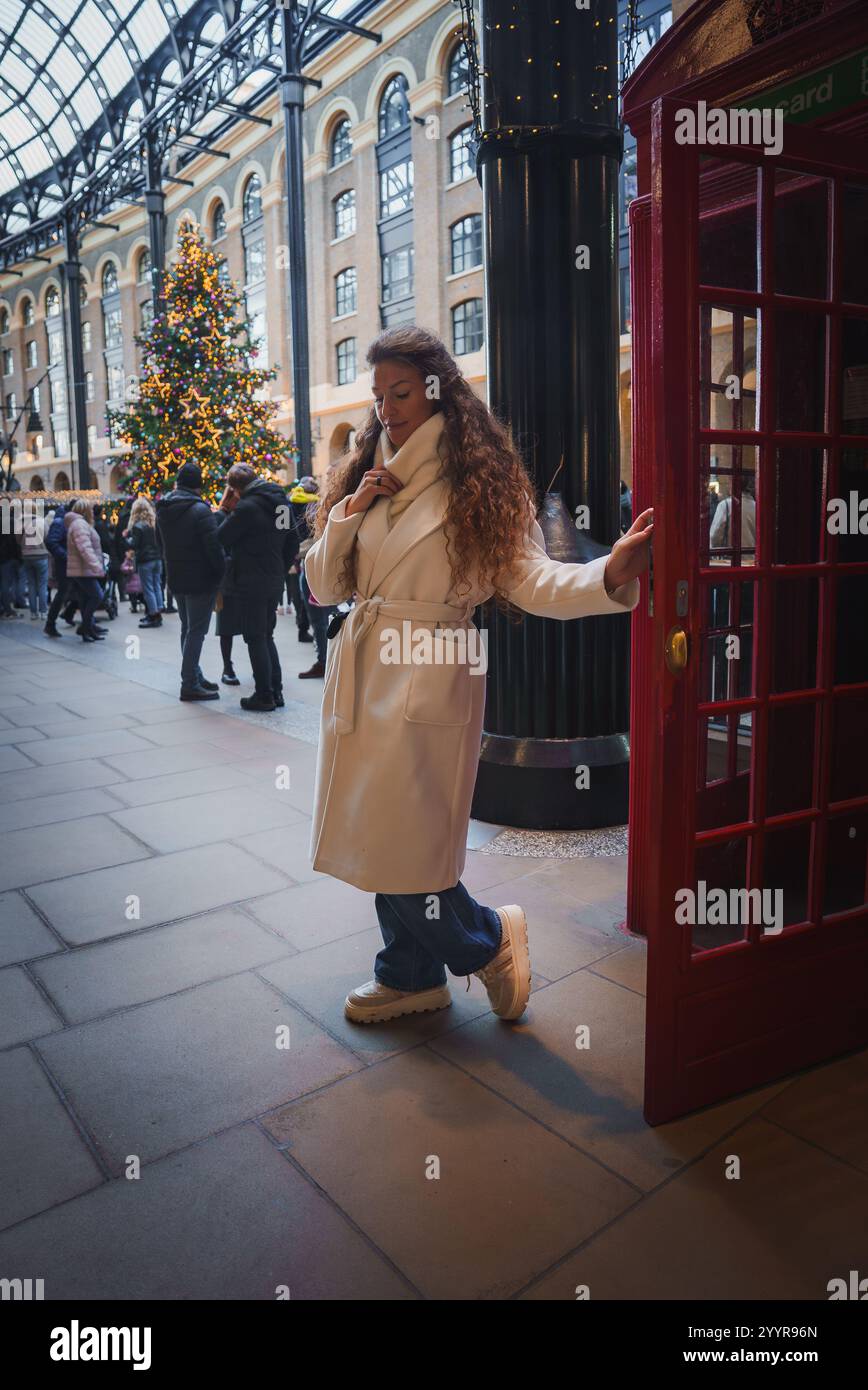 Festive Scene in London with Red Telephone Booth and Christmas Tree ...