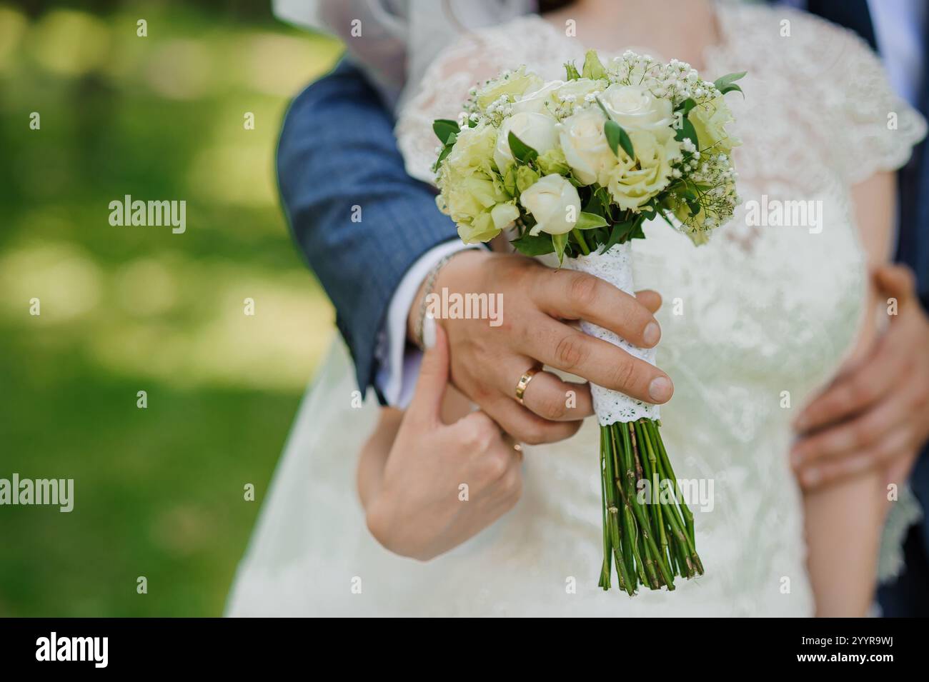 Romantic Wedding Moment Featuring Bride and Groom Embracing with a ...