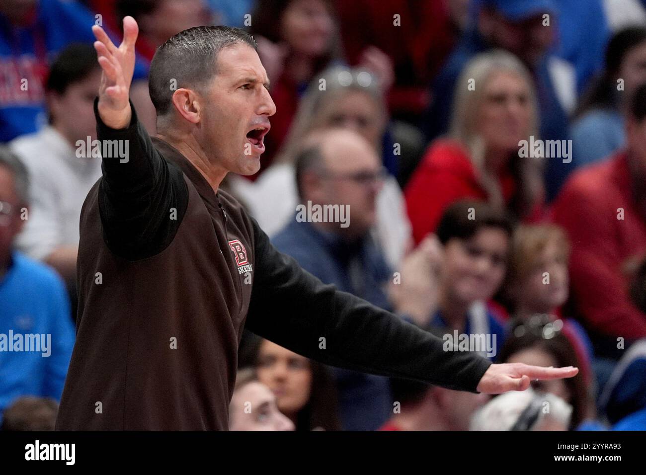 Brown head coach Mike Martin talks to his players during the first half ...