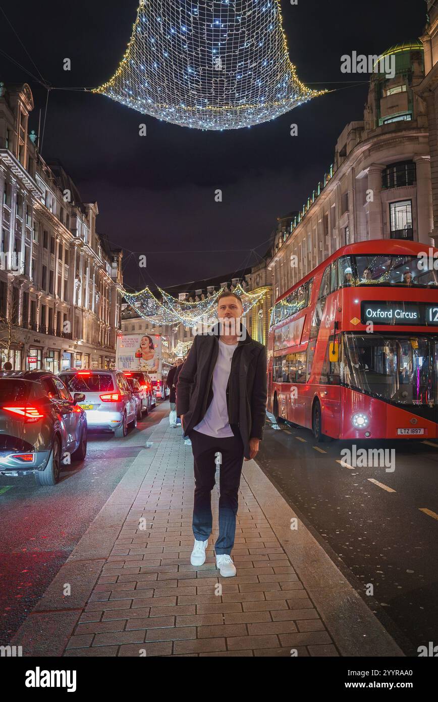 A bustling London street during Christmas features festive lights, a ...