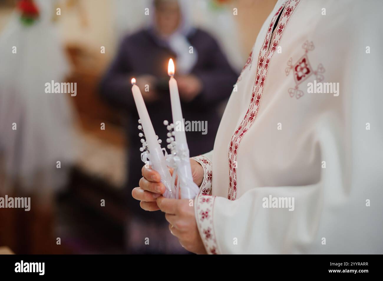 Ceremony of Light: A Priest Holding Lit Candles in a Traditional ...