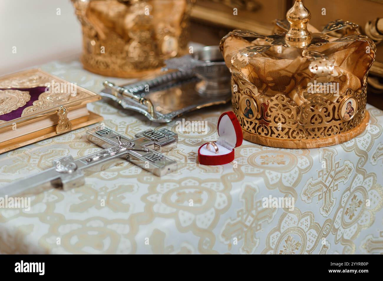 Ornate Wedding Ceremony Setup with Gold Crowns and Silver Cross Stock ...