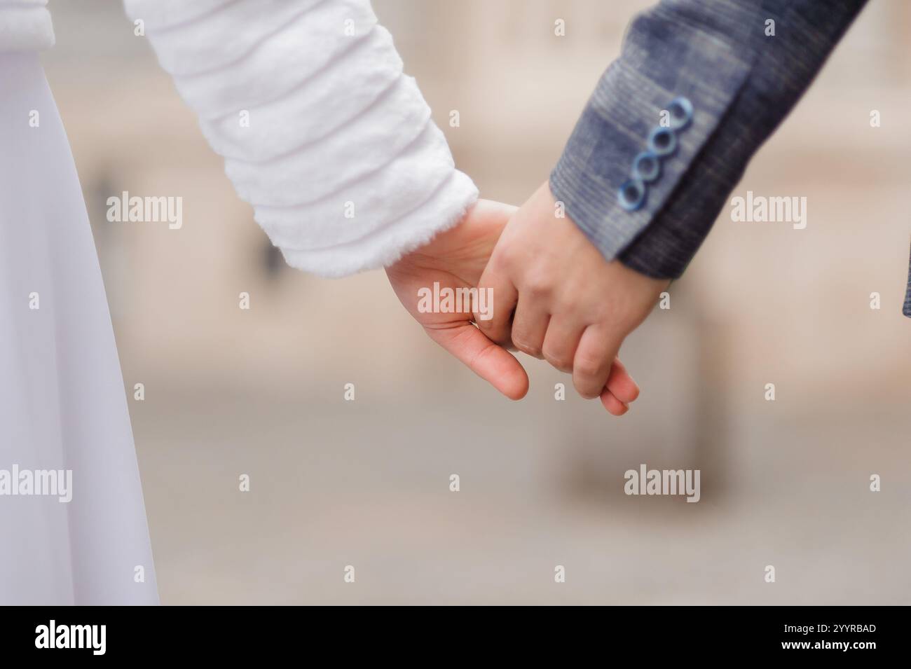 Romantic Connection: A Close-Up of Two Hands Interlocking in Unity ...