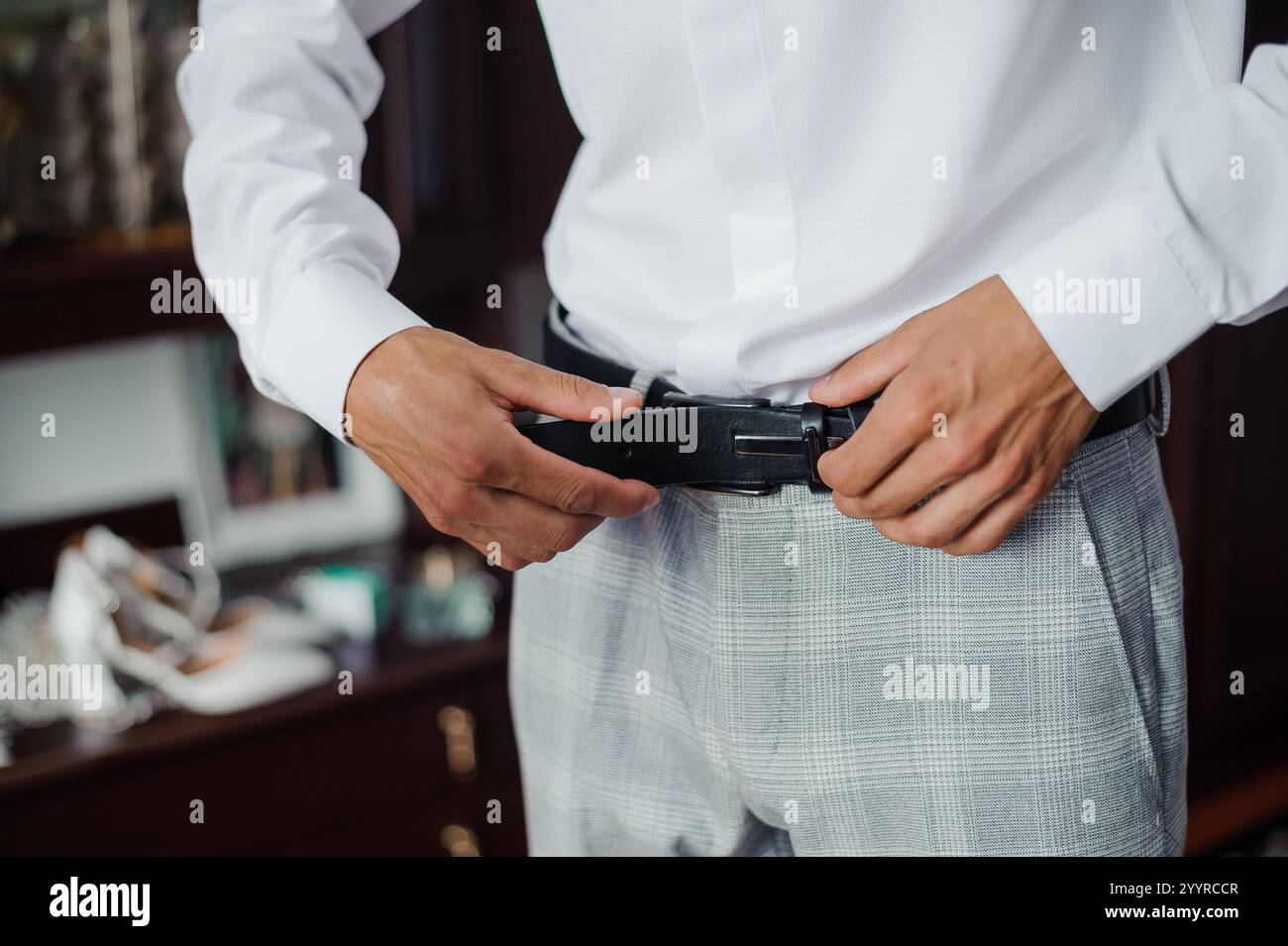 Adjusting belt hi-res stock photography and images - Alamy