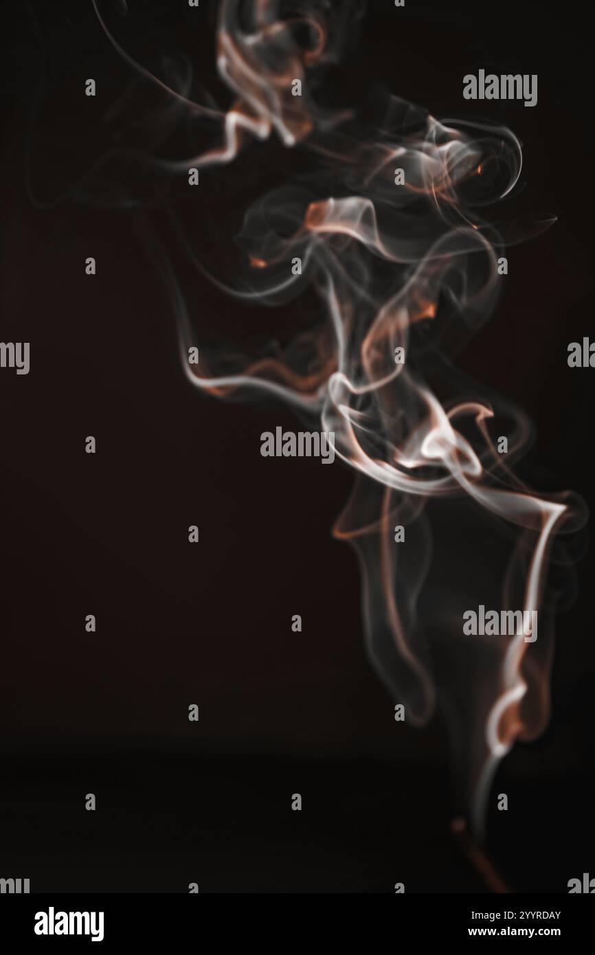 trend color 2025. Aroma sticks smoke on black background with white ...