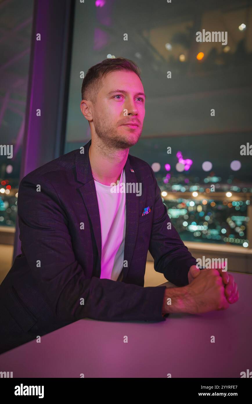 Man in Smart Casual Attire Overlooking London Cityscape at Night Stock ...