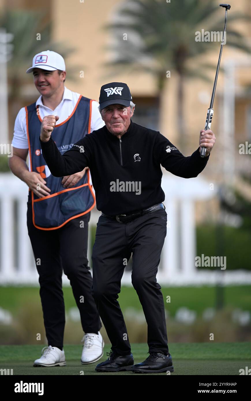 Gary Player, right, celebrates after making a putt on the 18th green as ...
