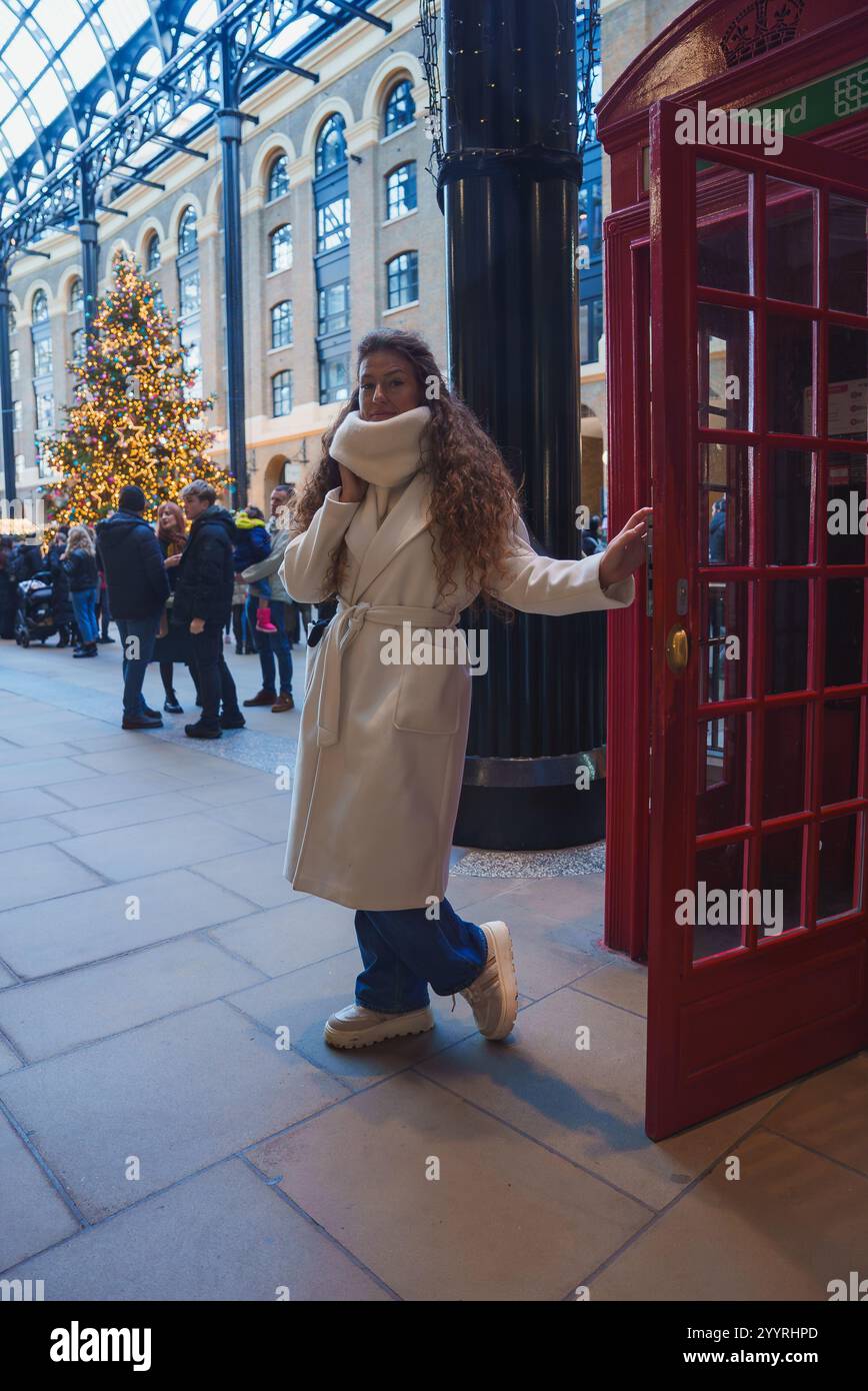 Festive Scene in London with Red Telephone Booth and Christmas Tree ...