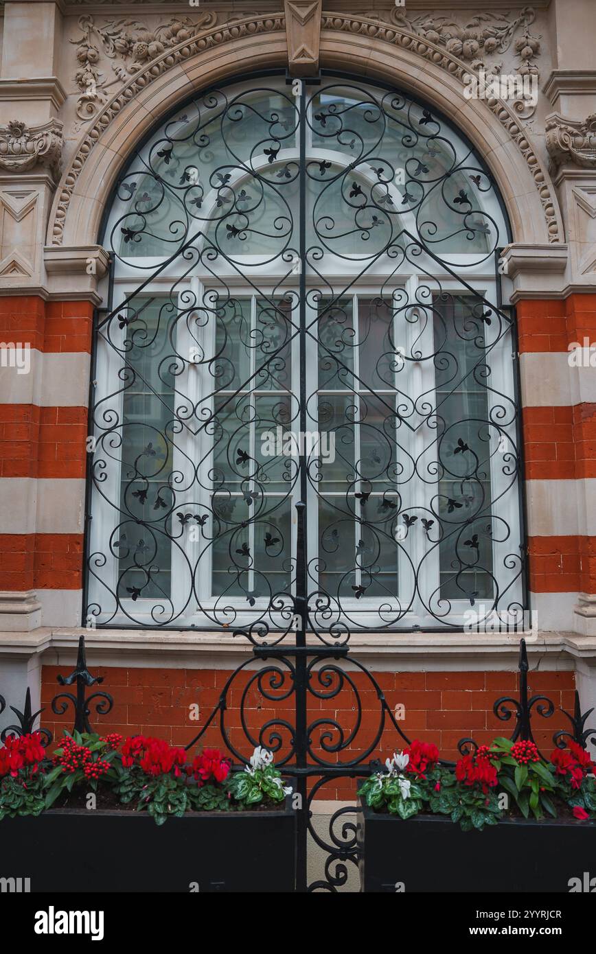 Ornate Arched Window with Floral Ironwork in London During Christmas ...