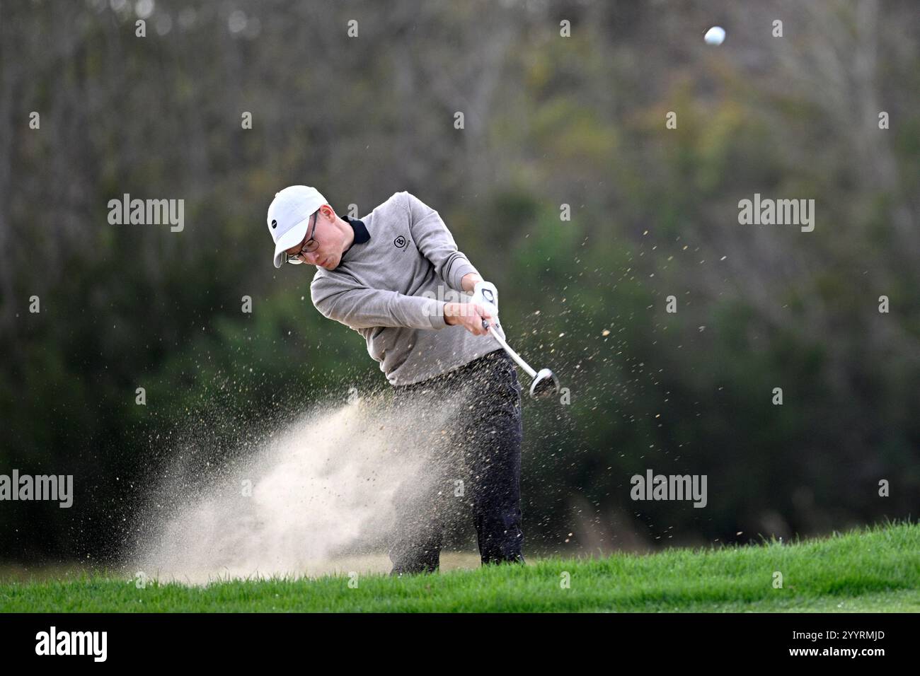 Jason Langer hits out of a bunker on the 14th fairway during the final ...