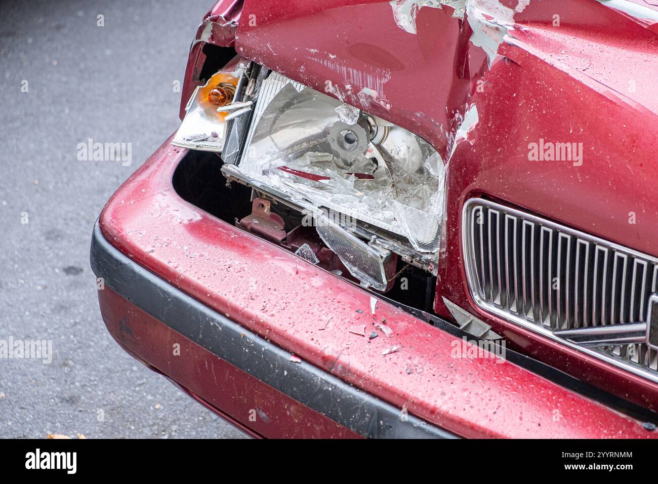 front view of the side of a red car dented by traffic impact Stock ...