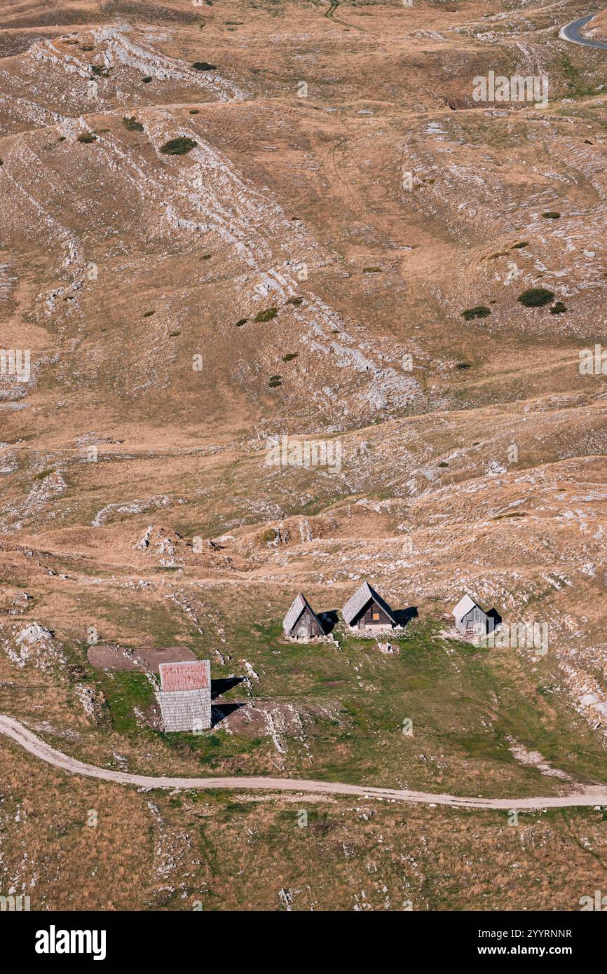 Traditional wooden huts nestled in the picturesque mountains of ...