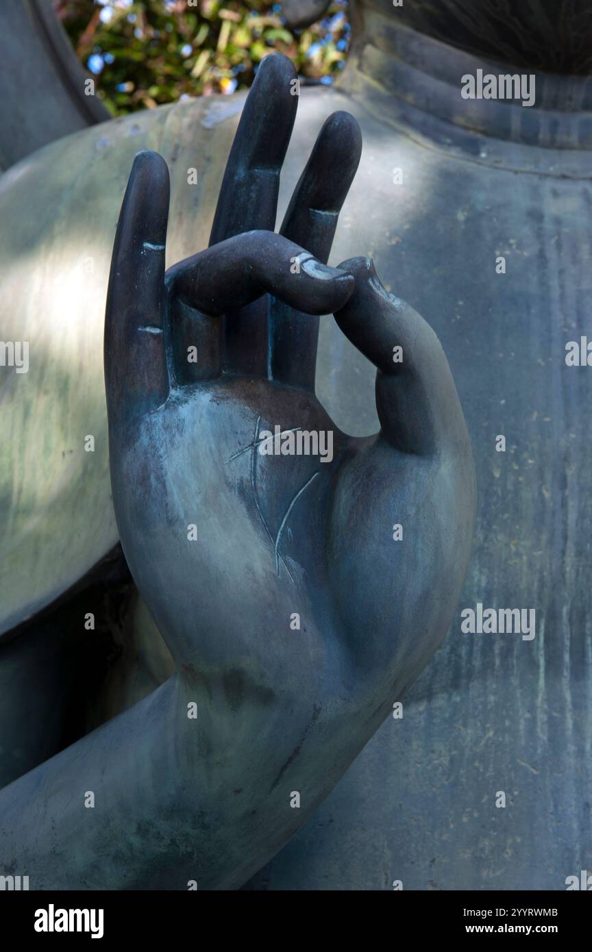 A bronze Buddha statue hand detail showing fingers touching at Kurodani ...
