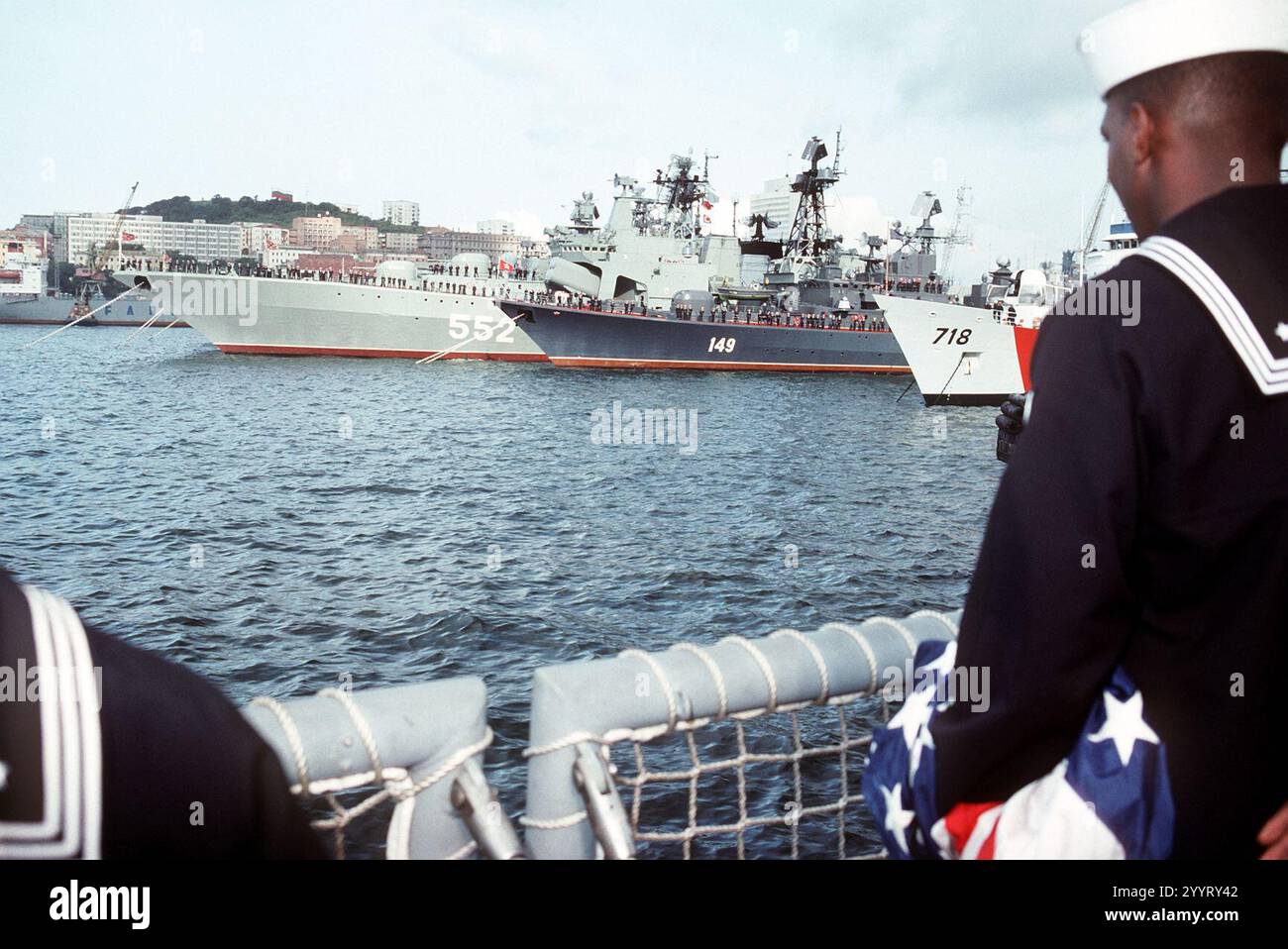 DN-ST-93-01246 A sailor on the stern of the guided missile frigate USS ...