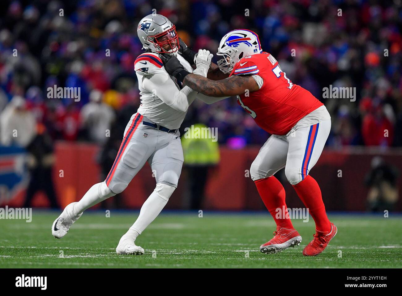 New England Patriots defensive end Deatrich Wise Jr., left, rushes ...