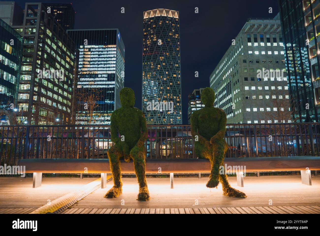 Nighttime View of Topiary Figures and Skyscrapers in Canary Wharf Stock ...
