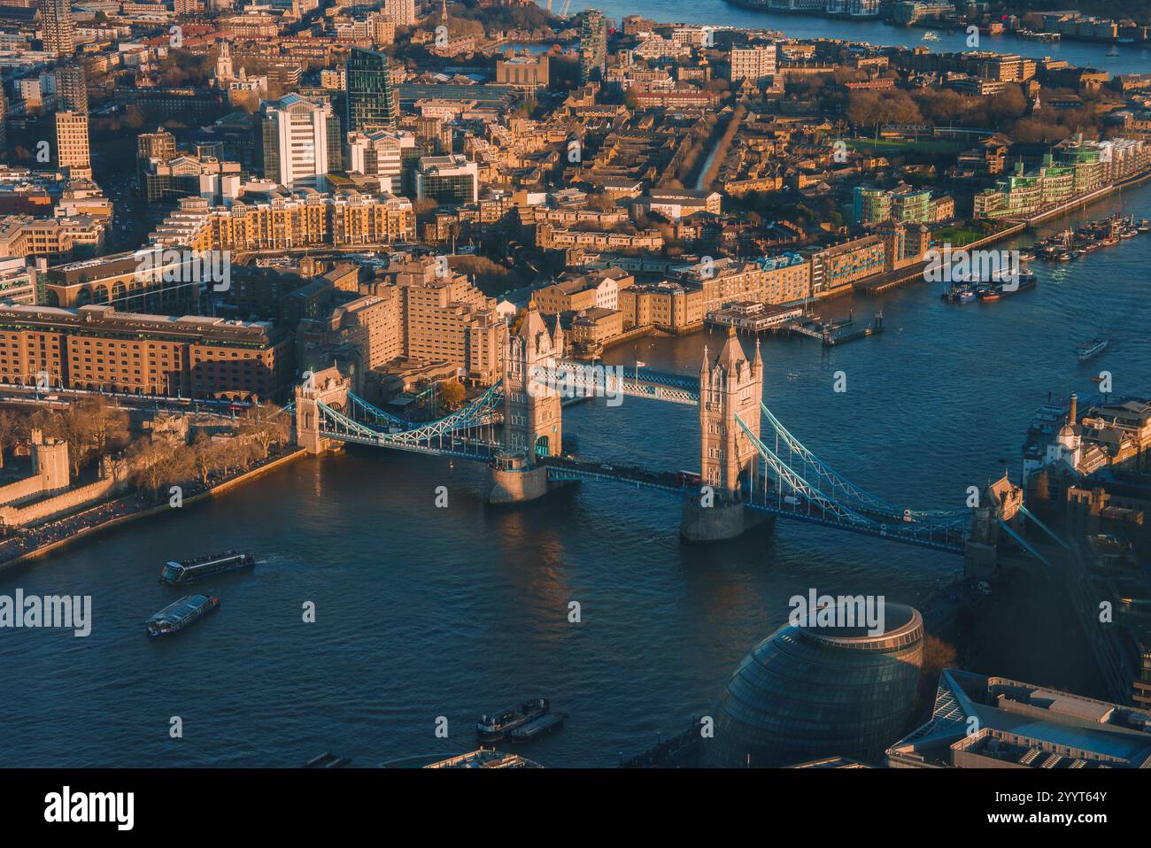 Aerial view of London's Tower Bridge over the River Thames at sunset ...