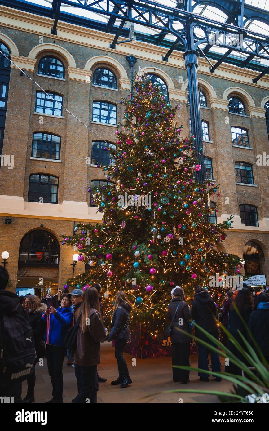 Festive Scene Inside Historic London Building with Christmas Tree Stock ...