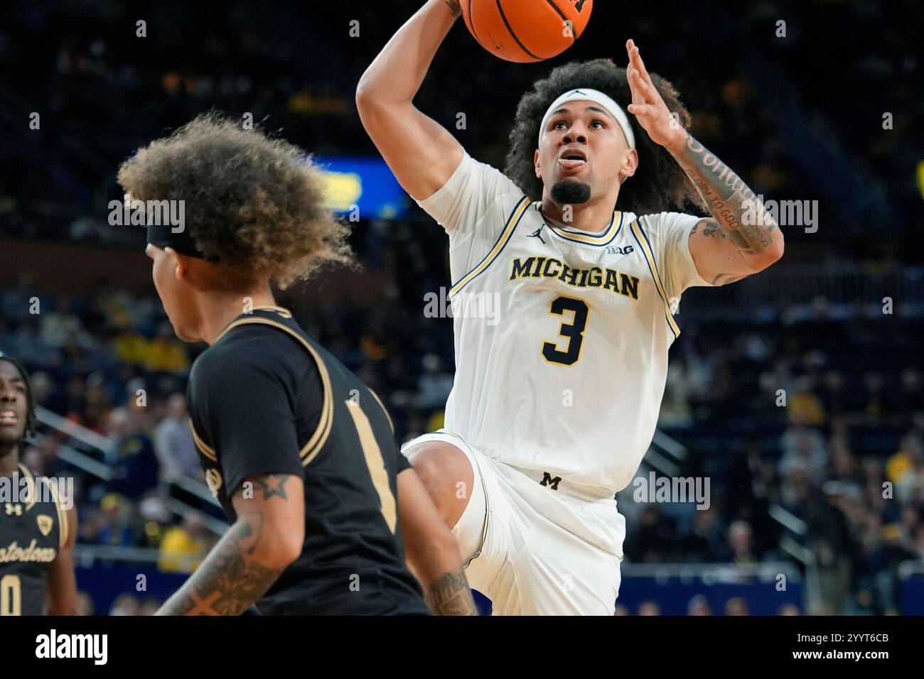 Michigan guard Tre Donaldson (3) attempts a layup during the second ...