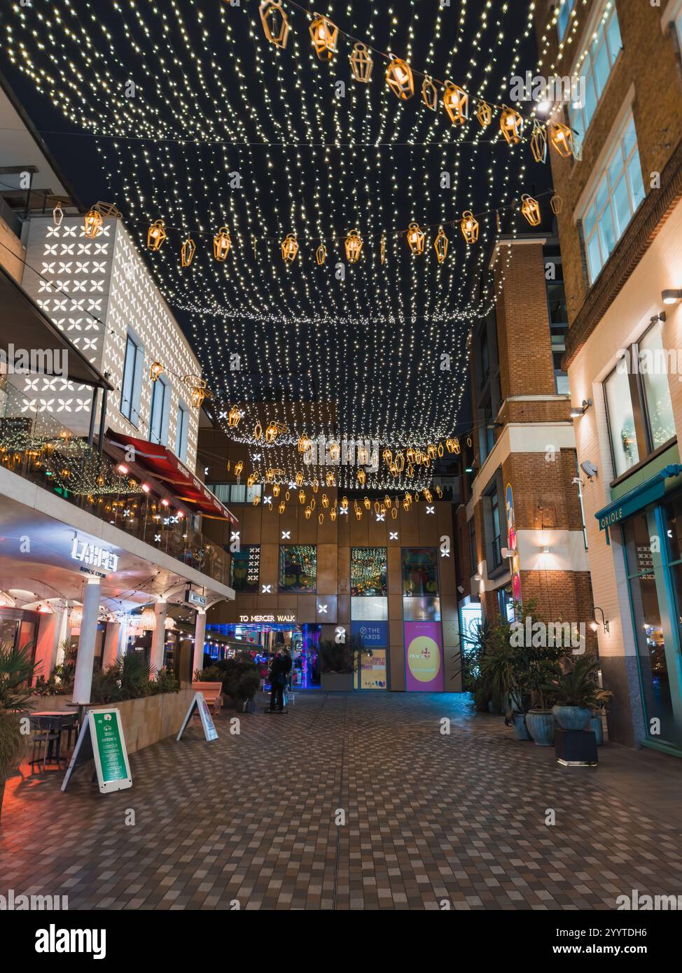 Festive London Street with Christmas Lights and Mixed Architecture ...