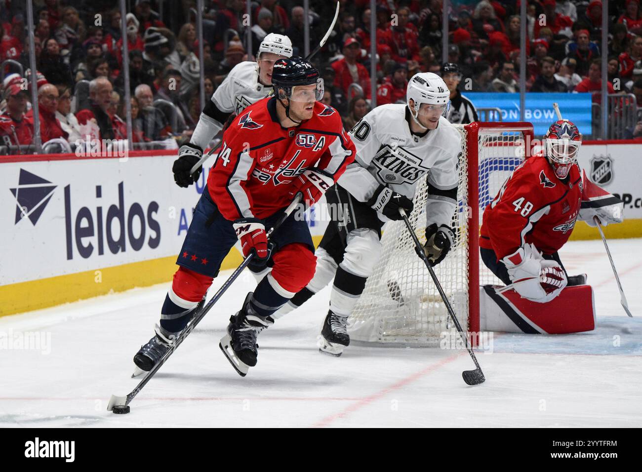Washington Capitals defenseman John Carlson (74) handles the puck ...