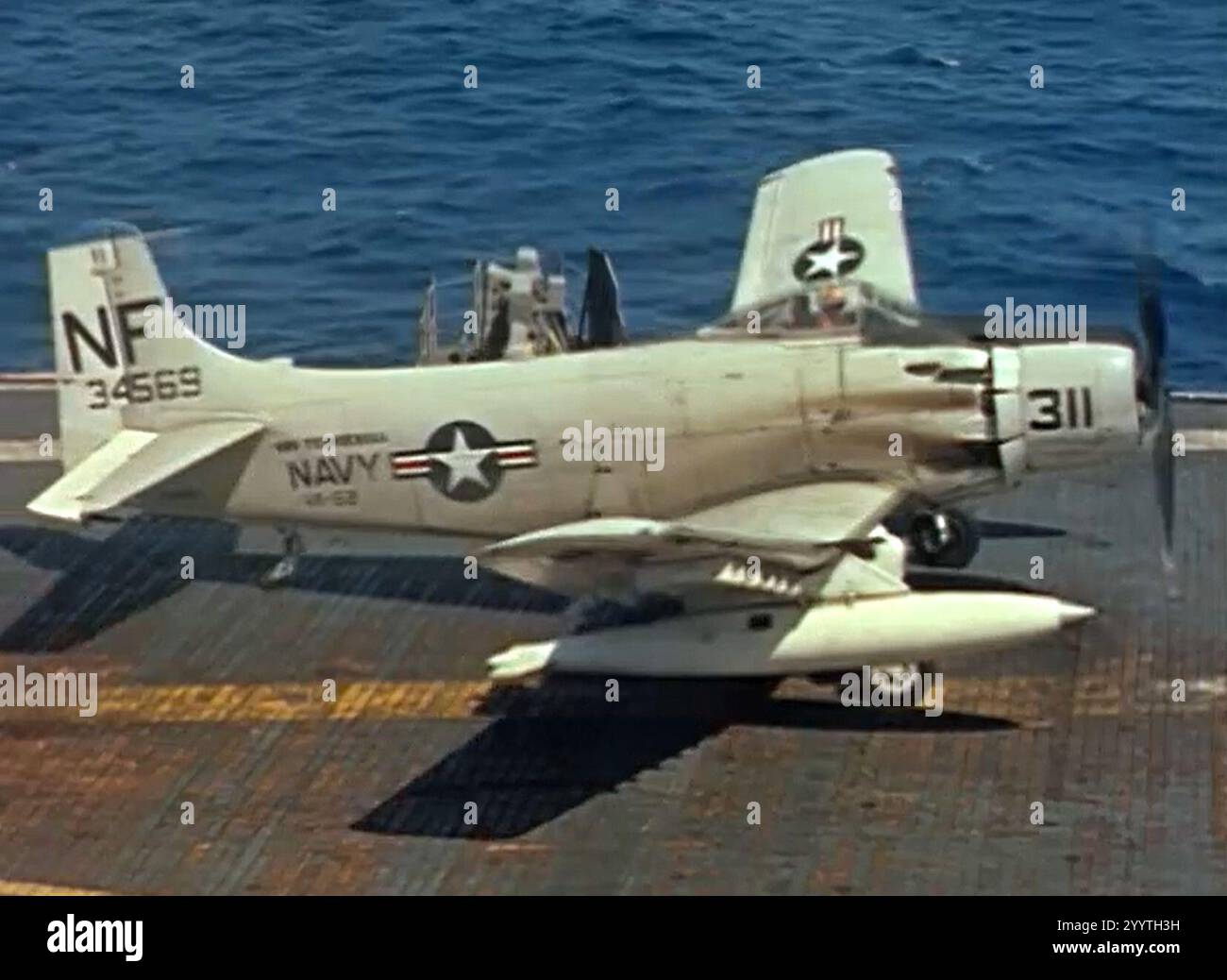 Douglas A-1H Skyraider from VA-52 folding its wings after landing ...
