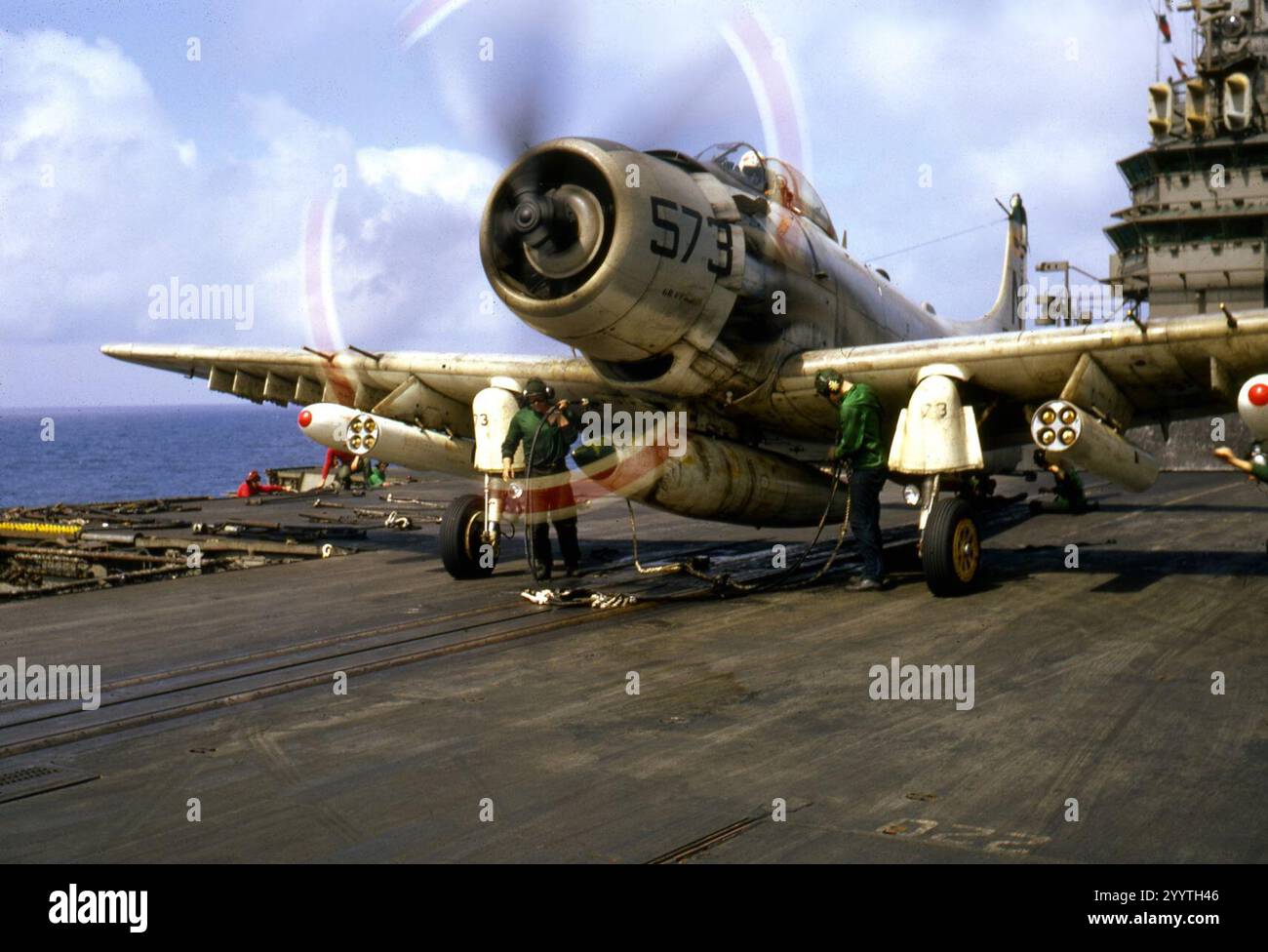 Douglas A-1H Skyraider of VA-25 is readied for launching from USS Coral ...