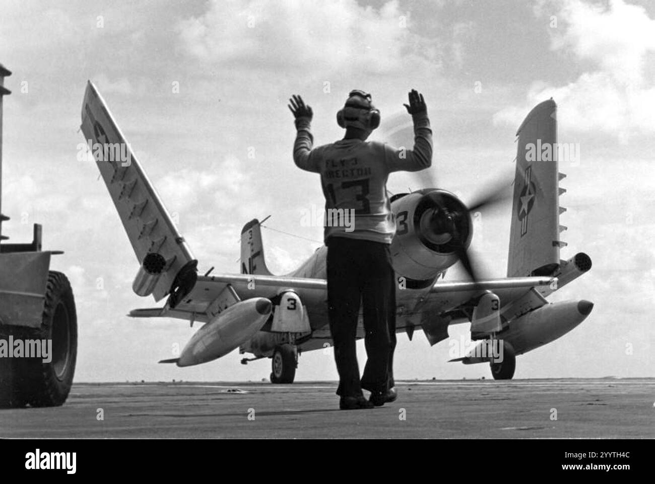 Douglas A-1H Skyraider of VA-52 folds its wings after landing aboard ...
