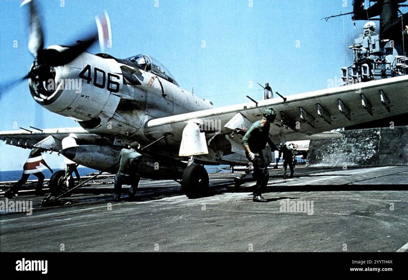 Douglas A-1H Skyraider of VA-25 is readied for launching from USS Coral ...