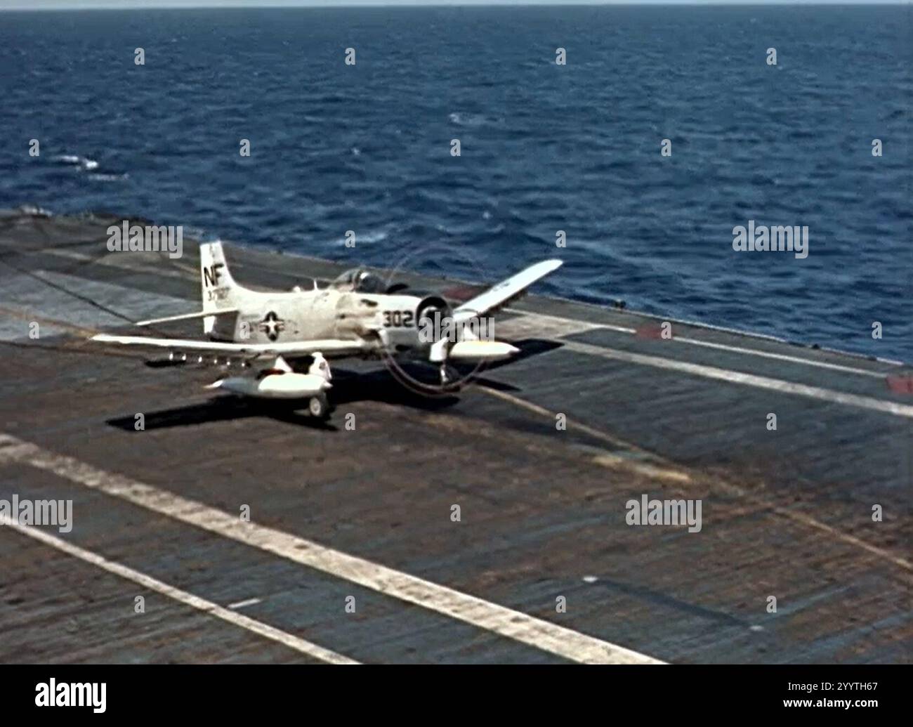 Douglas A-1H Skyraider of VA-52 folding its wings after landing aboard ...