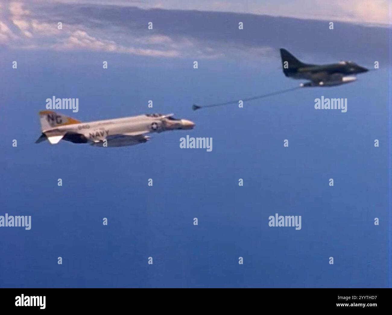 Douglas A-4C Skyhawk of VA-113 refuels a McDonnell F-4B Phantom II of ...
