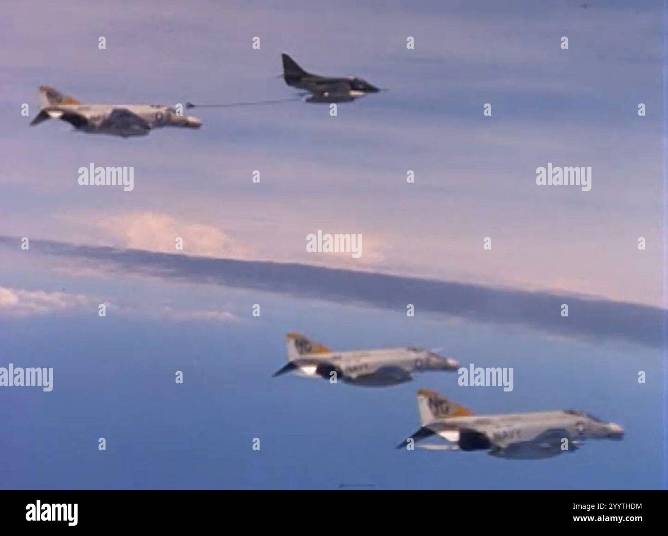 Douglas A-4C Skyhawk of VA-113 refuels three McDonnell F-4B Phantom II ...