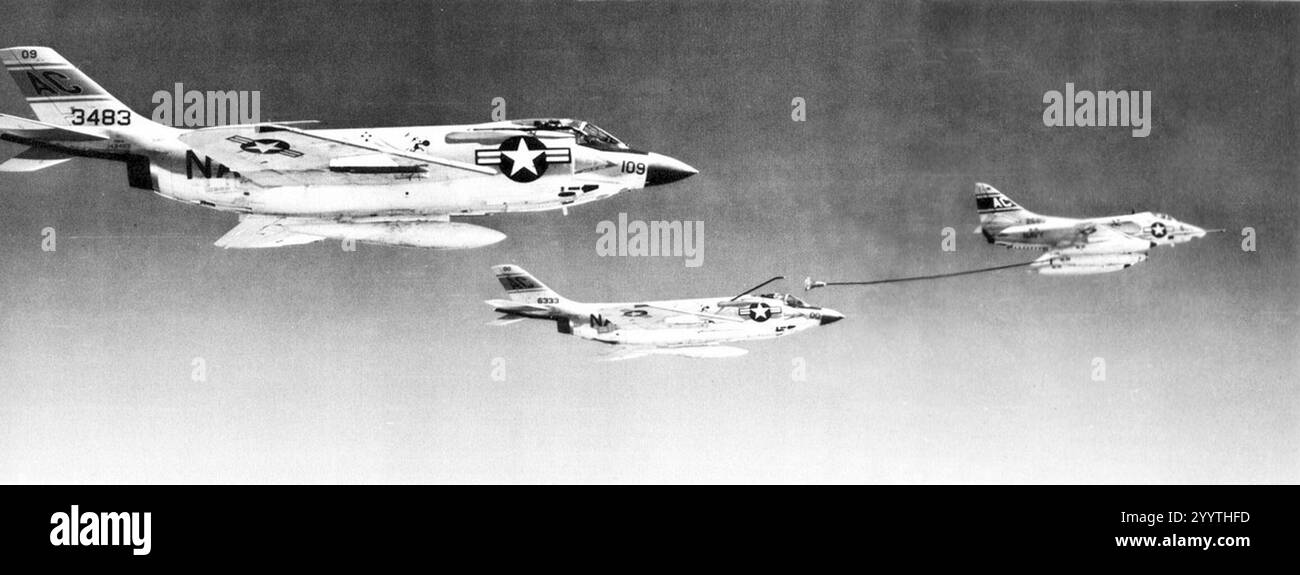 Douglas A4D-2 Skyhawk of VA-36 refuels McDonnell F3H-2 Demons of VF-31 ...