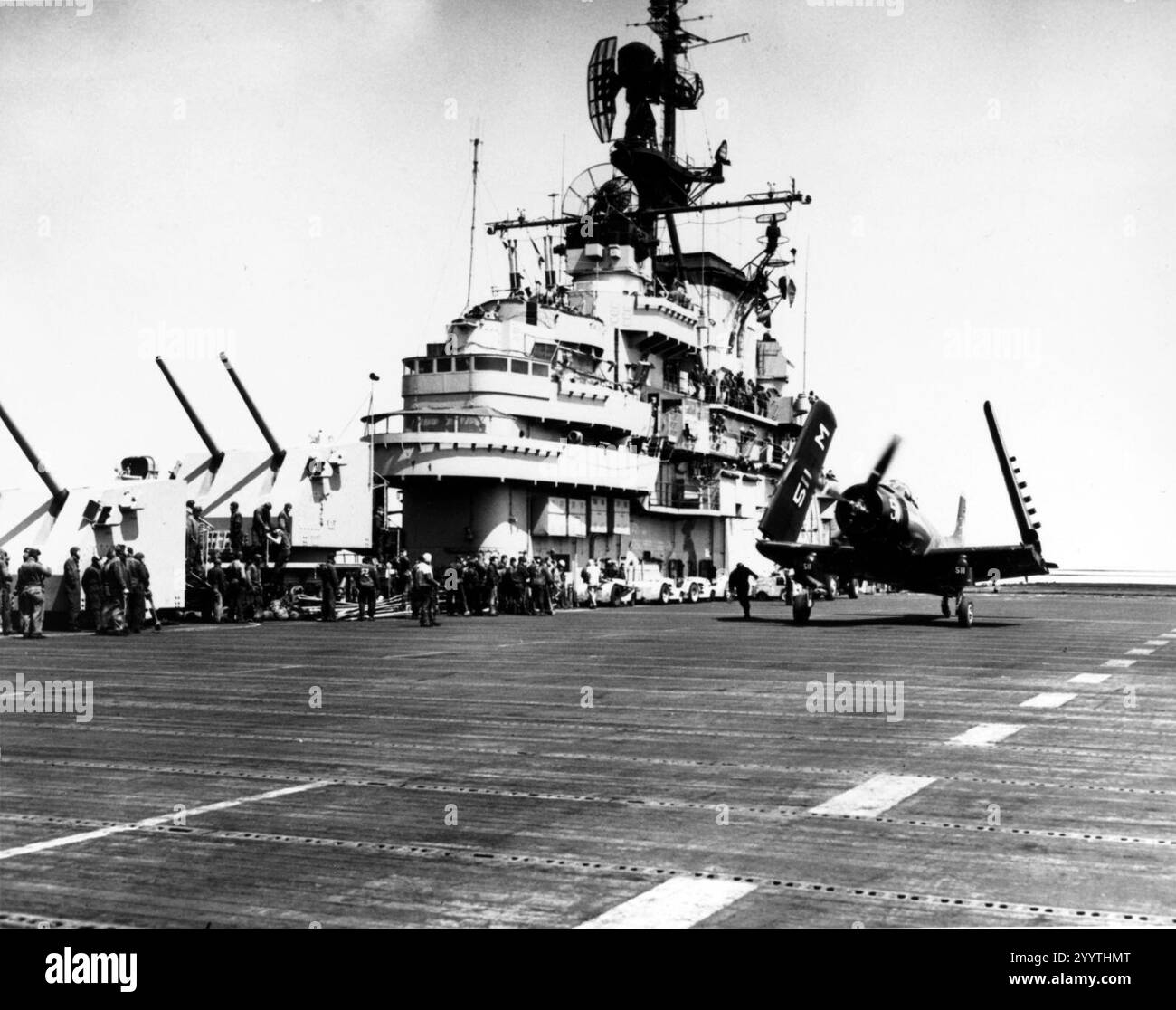 Douglas AD-2 Skyraider of VA-65 taxies forward on the flight deck of ...