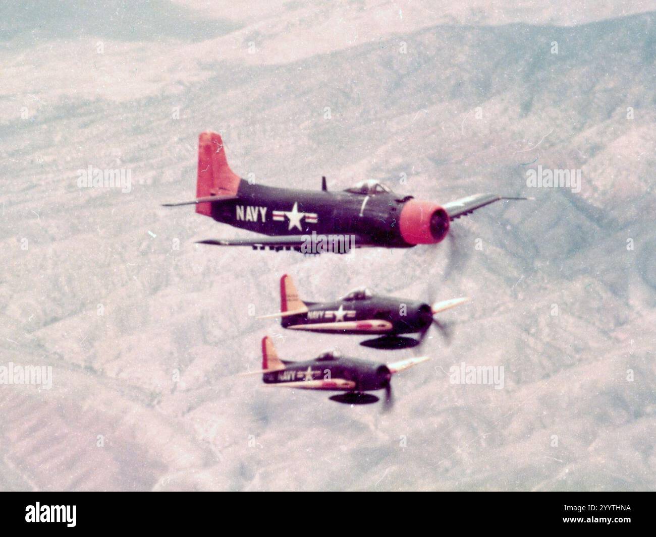 Douglas AD-2D Skyraider and two Grumman F8F Bearcat in flight over ...