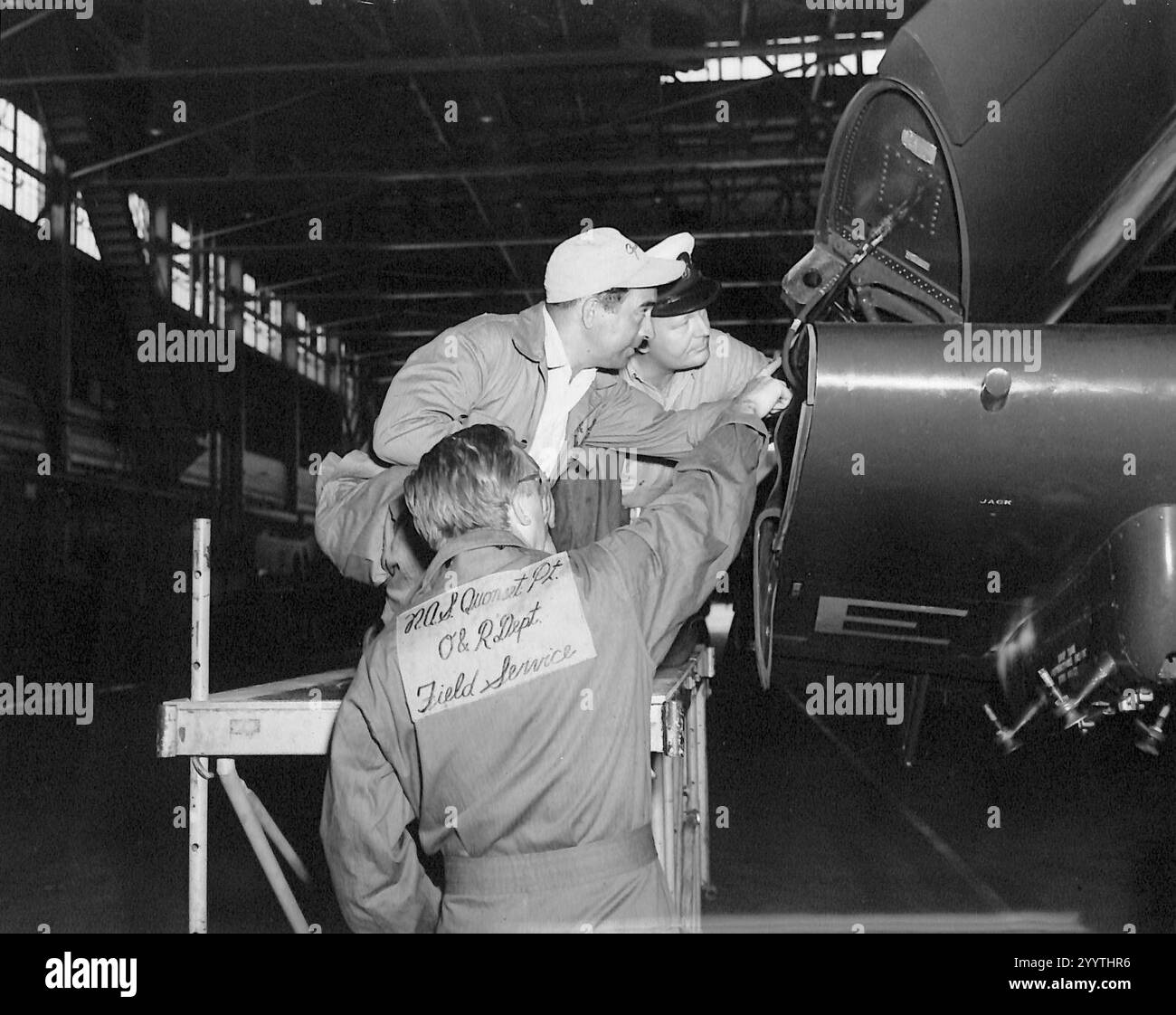 Douglas AD-3W Skyraider of VC-12 is examined at NARF Quonset Point ...