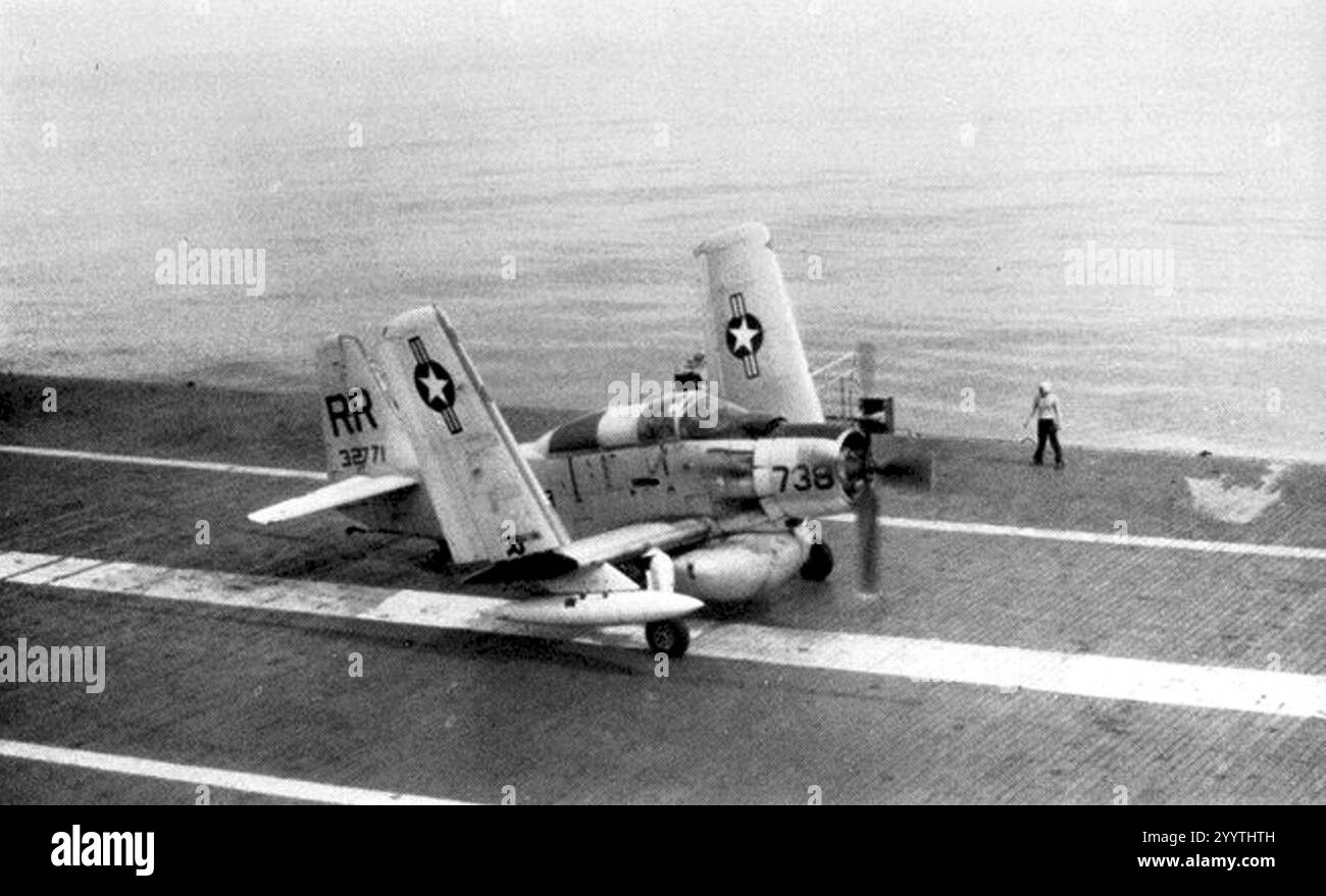 Douglas AD-5W Skyraider of VAW-11 Det.J folding its wings after landing ...