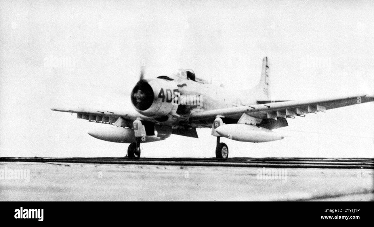 Douglas AD-6 Skyraider of VA-85 lands aboard USS Intrepid (CVA-11), in ...