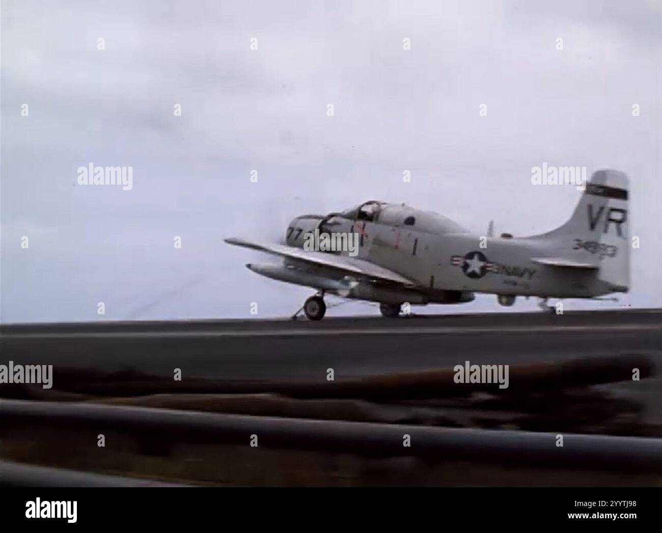 Douglas EA-1F Skyraider of VAW-13 Det.C is launched from USS Kitty Hawk ...