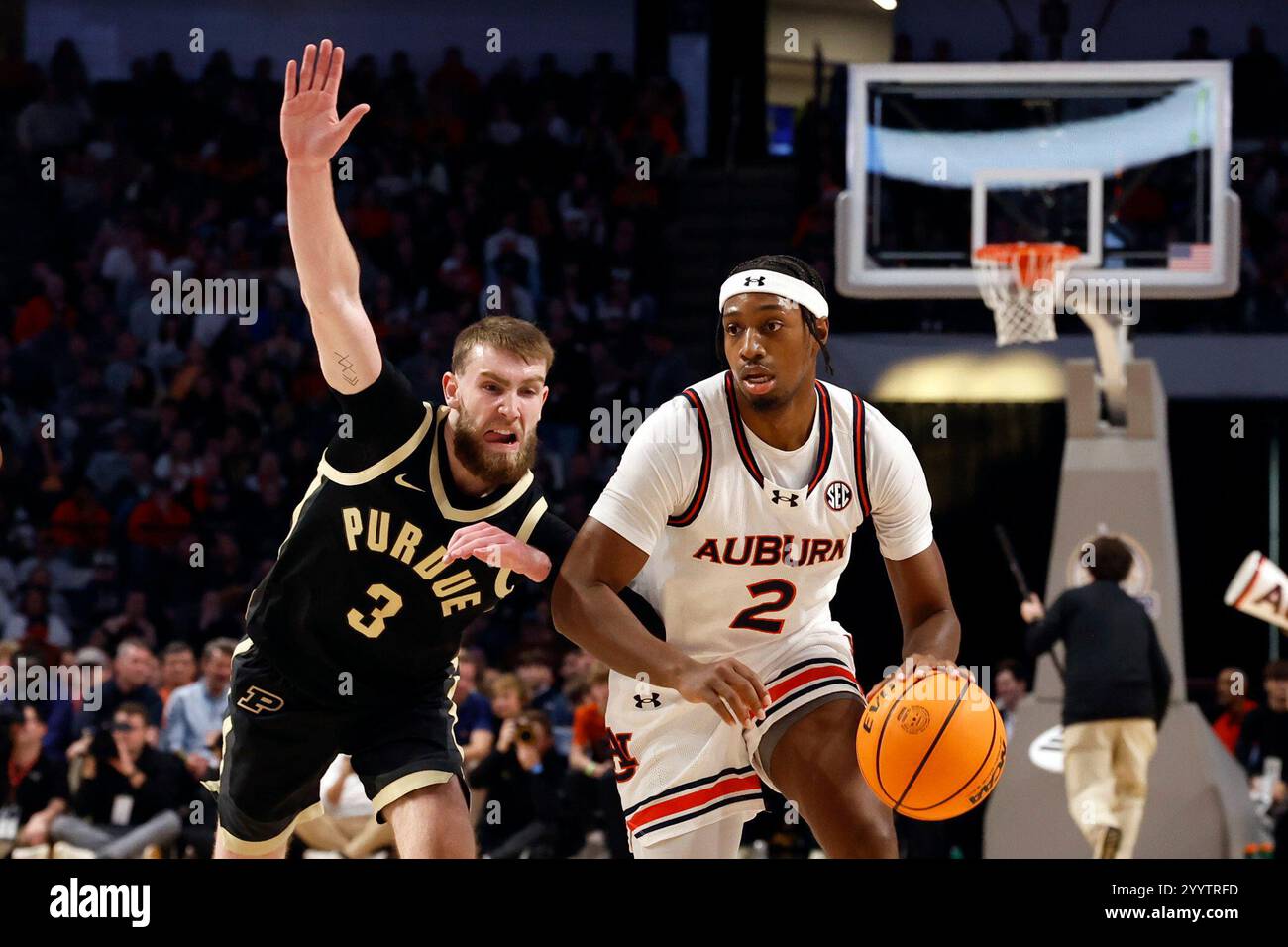 Auburn guard Denver Jones (2) dribbles around Purdue guard Braden Smith ...